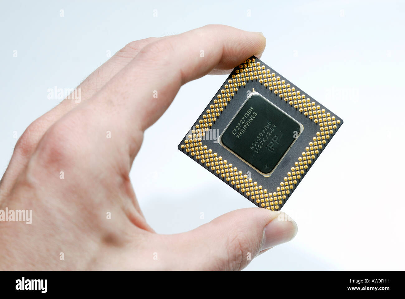Computer processor detail close up in man hand Stock Photo - Alamy
