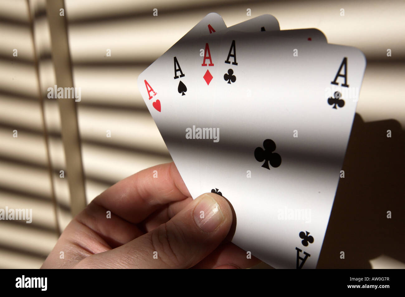A hand of four aces Stock Photo - Alamy