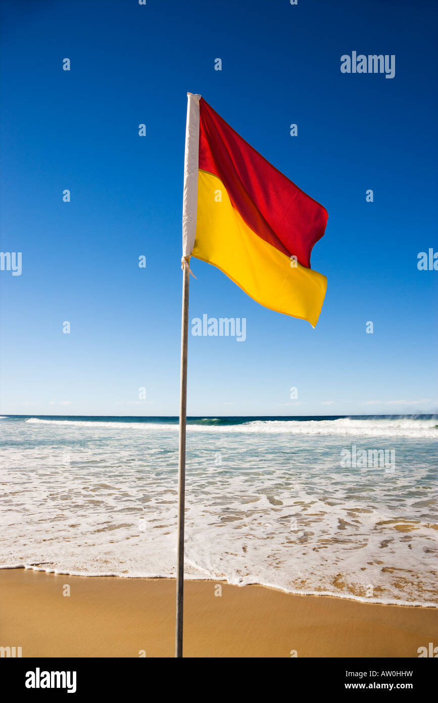 Flag on beach Stock Photo - Alamy
