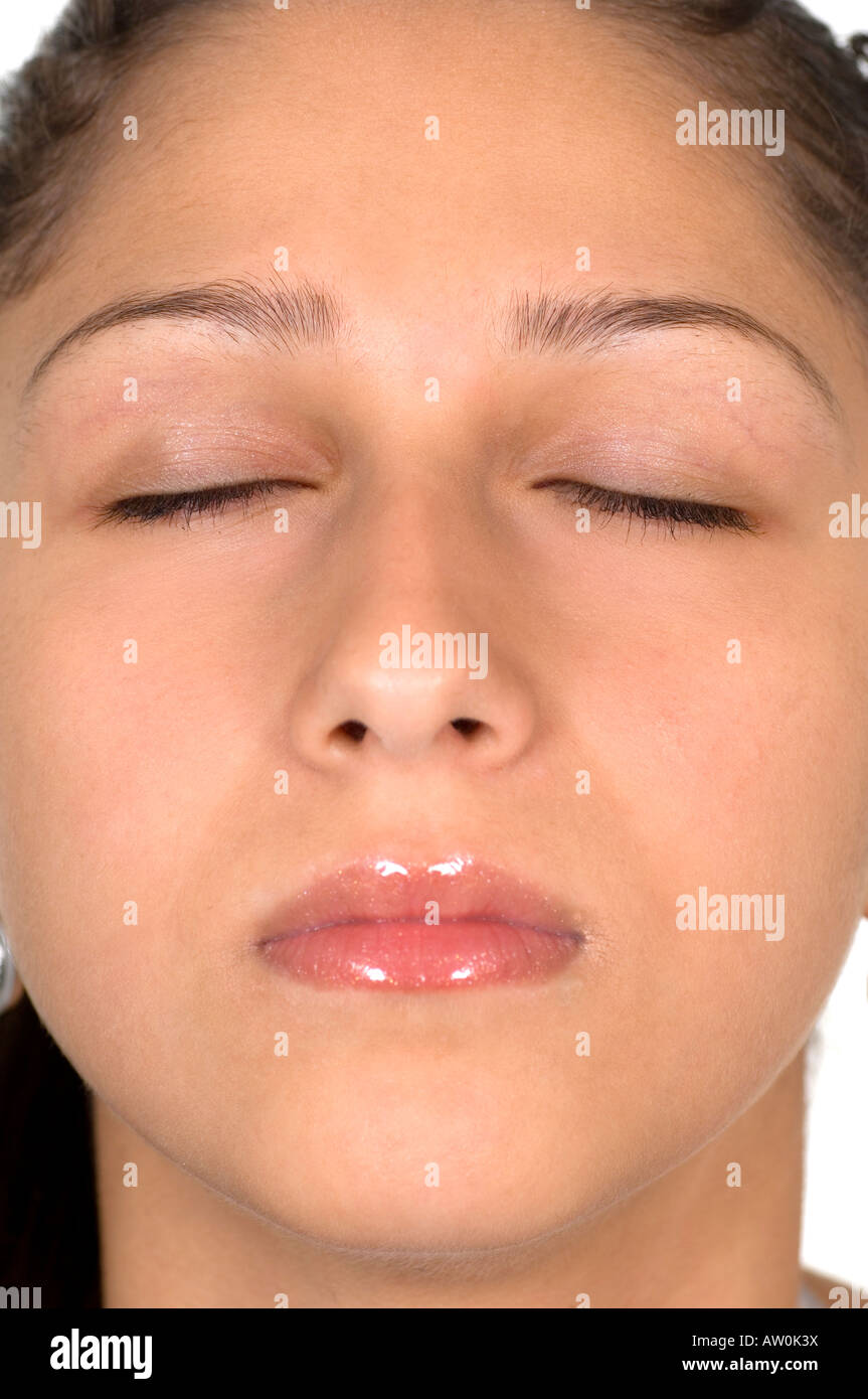 Close up of beautiful young teenage girl eyes closed Stock Photo - Alamy