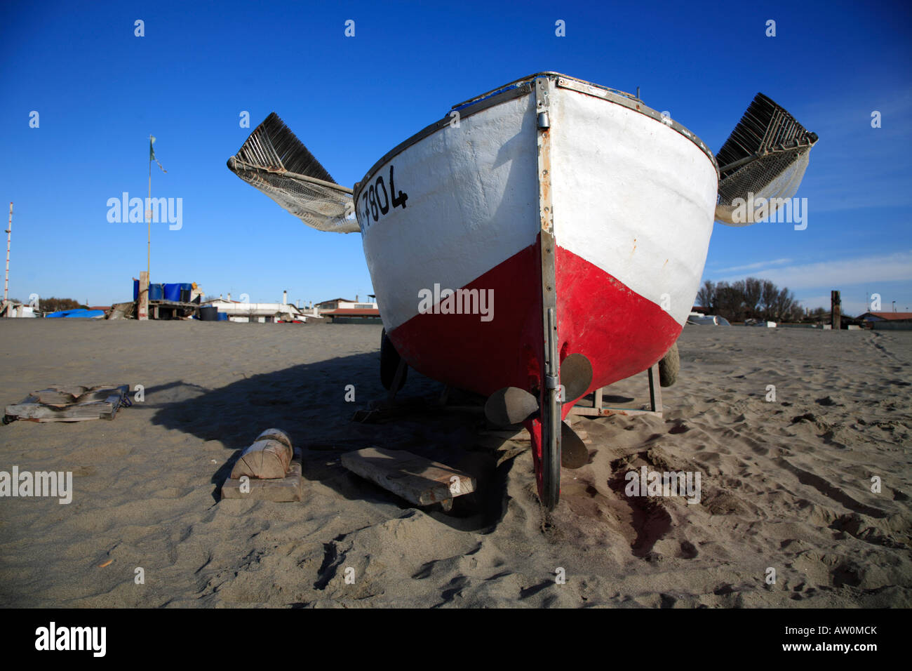 small fishing boat used to catch shellfish pulled up on beach Stock ...