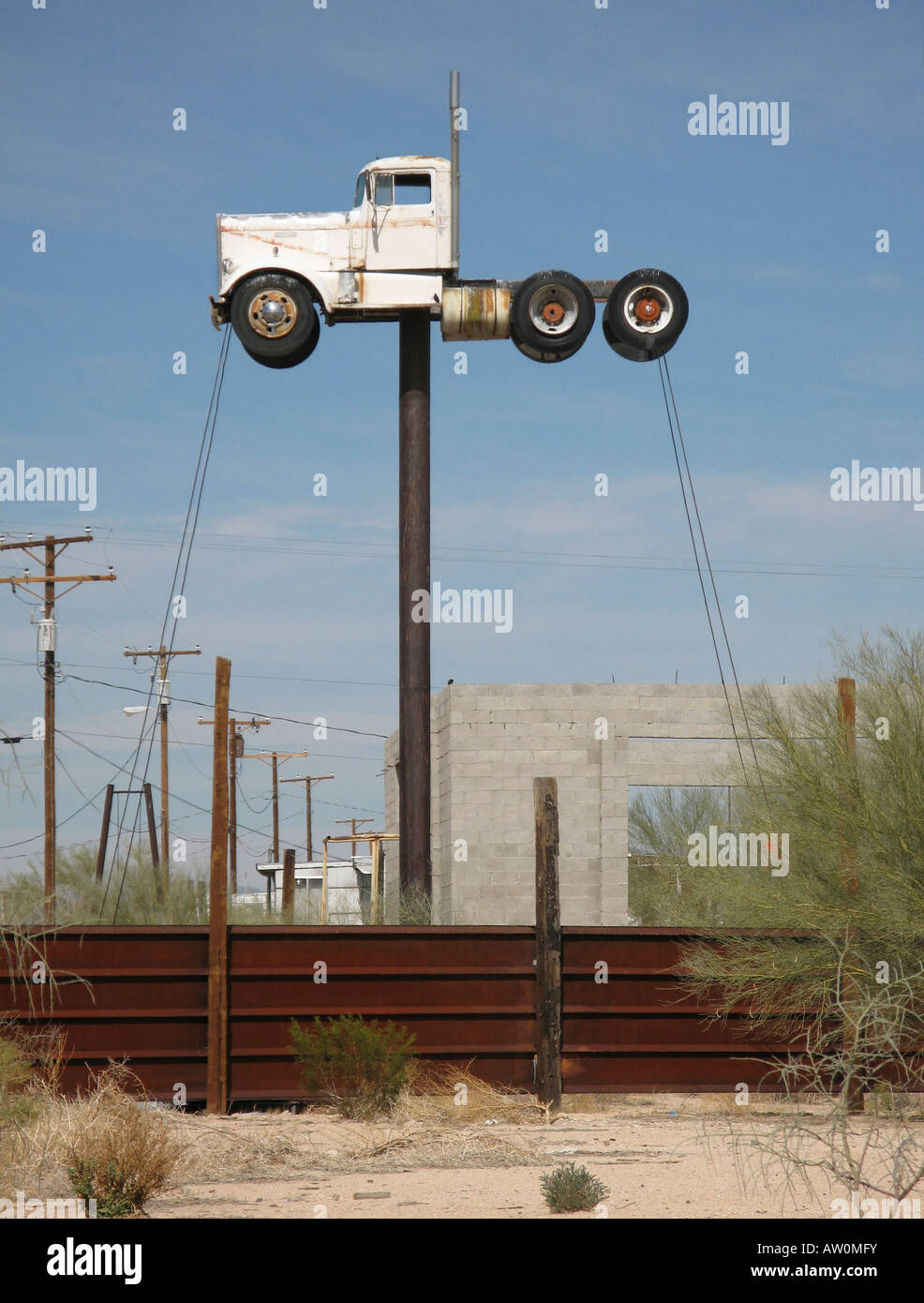 Semi truck cab on a pole raised high above the ground Stock Photo - Alamy