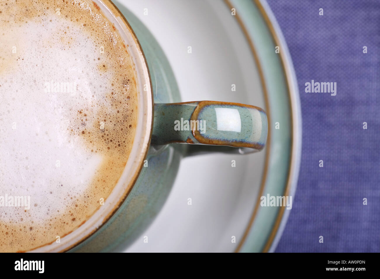 freshly poured coffee with frothy milk focus on bubbles Stock Photo - Alamy