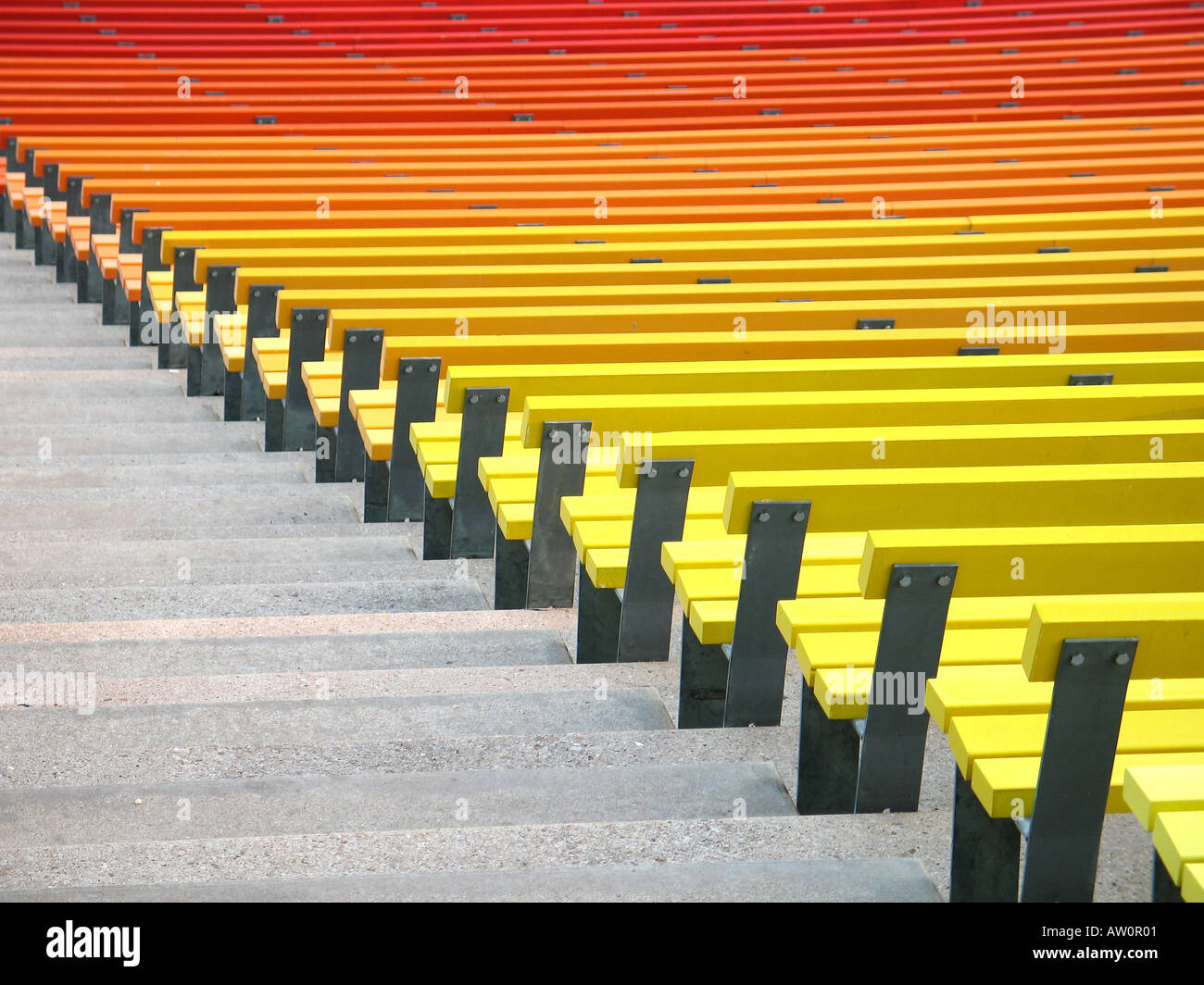 Colours of Benches from Yellow to Red Stock Photo - Alamy