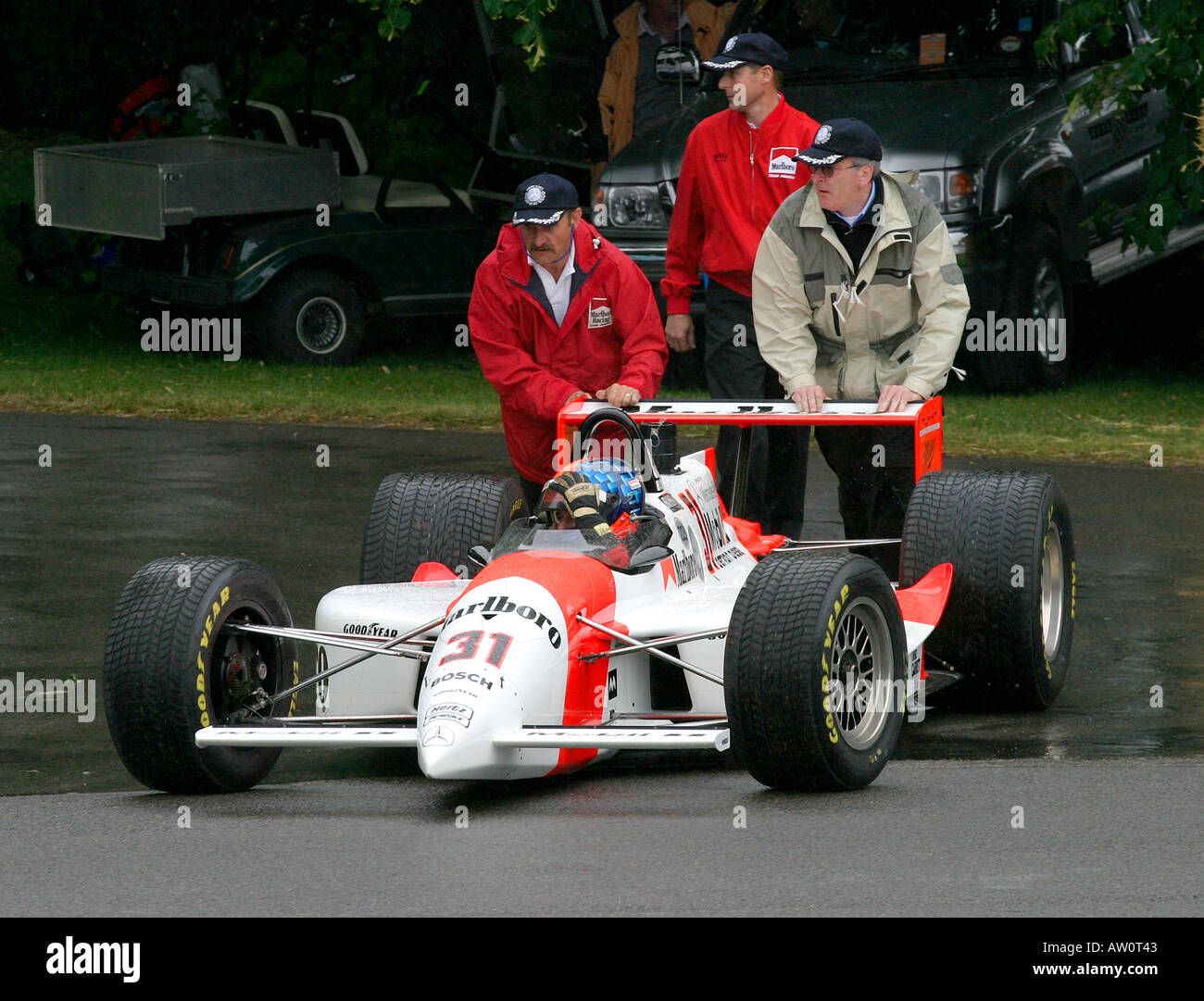 1994 Penske Mercedes PC23 is pushed out of the paddock at Goodwood ...