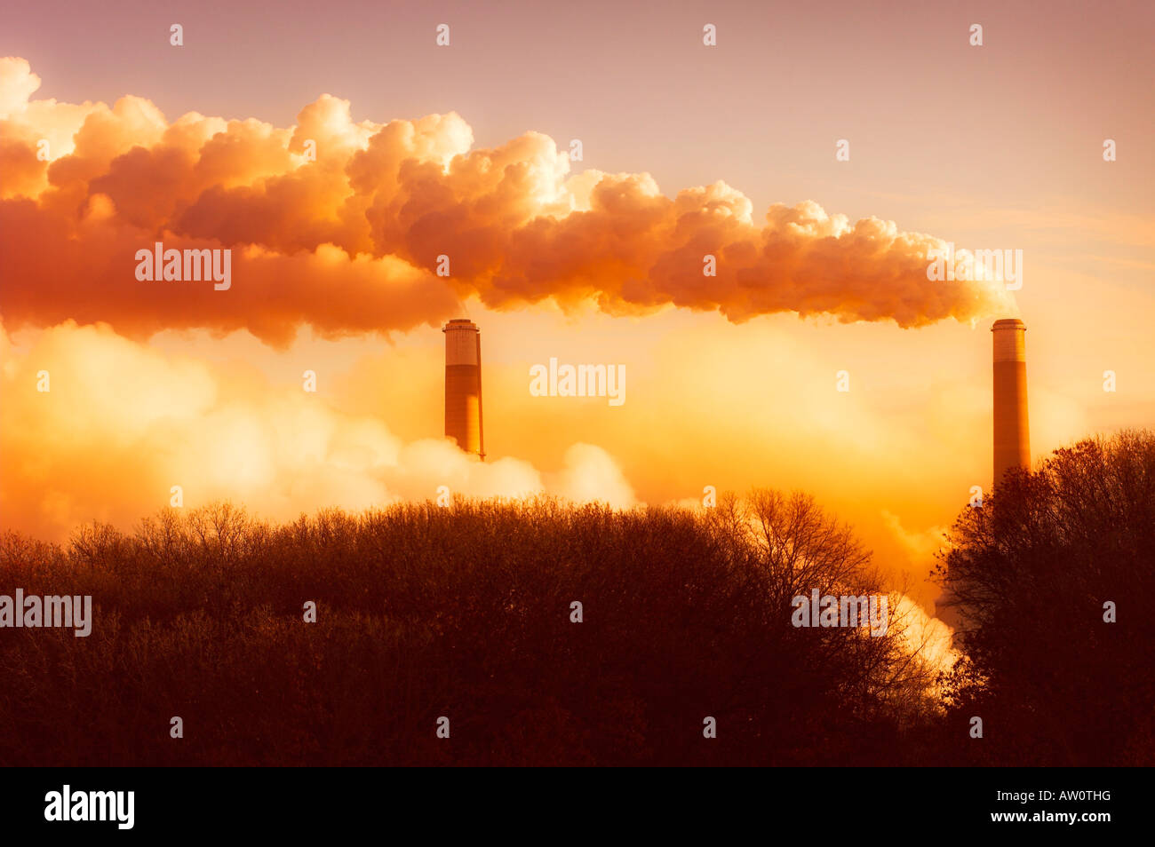 Steam rising from stack and cooling towers at nuclear power plant on ...