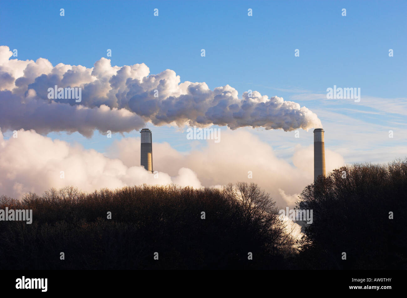 Steam rising from stack and cooling towers at nuclear power plant on ...