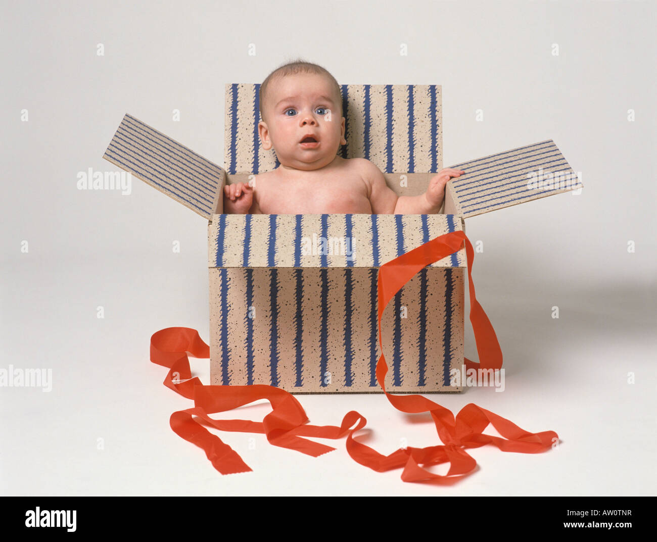 Little boy in a gift box Stock Photo - Alamy