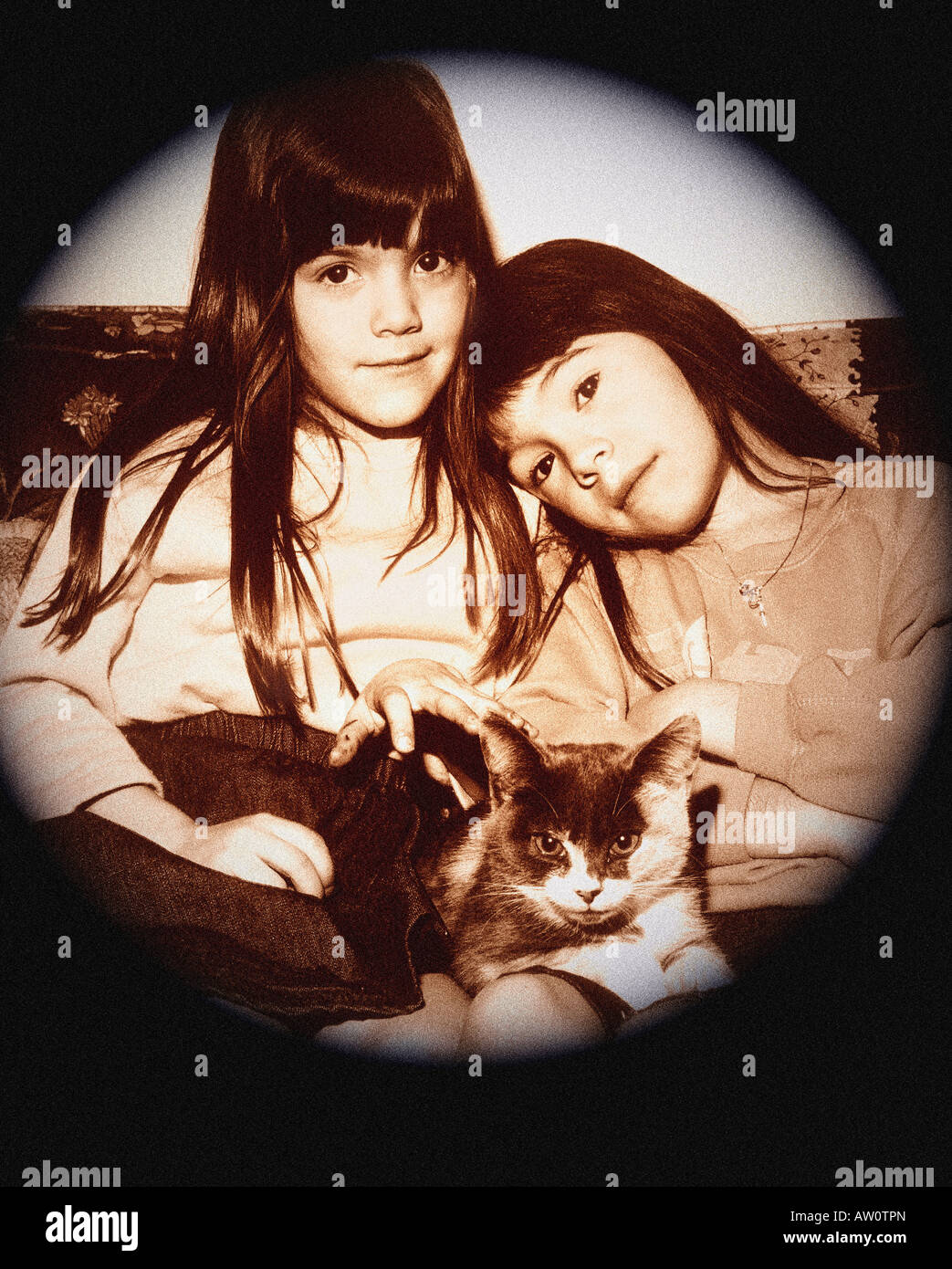 Two girls with a cat hi-res stock photography and images - Alamy