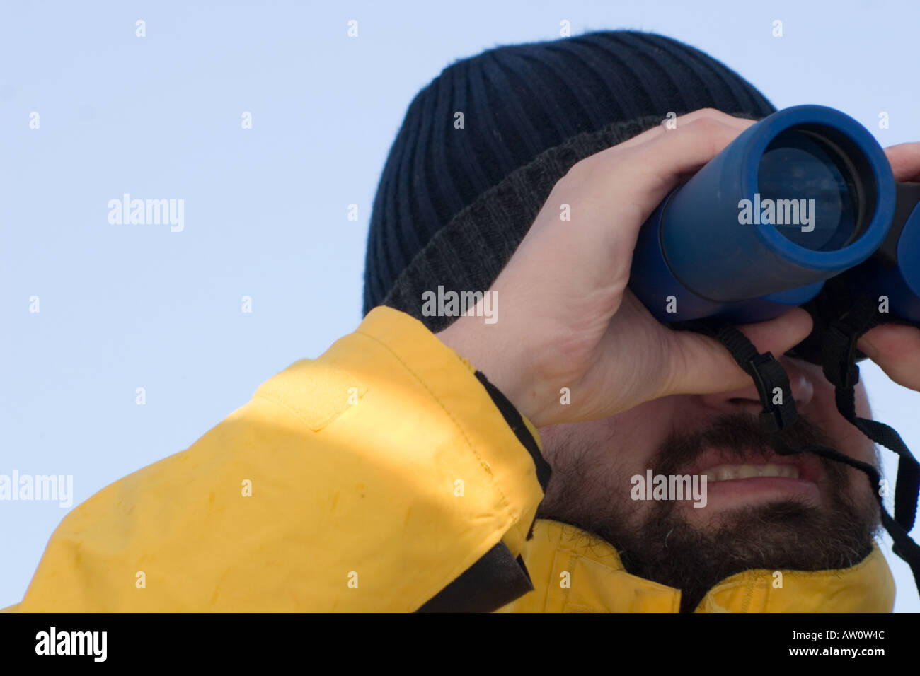 Sailor in yellow raincoat sailing hi-res stock photography and images ...