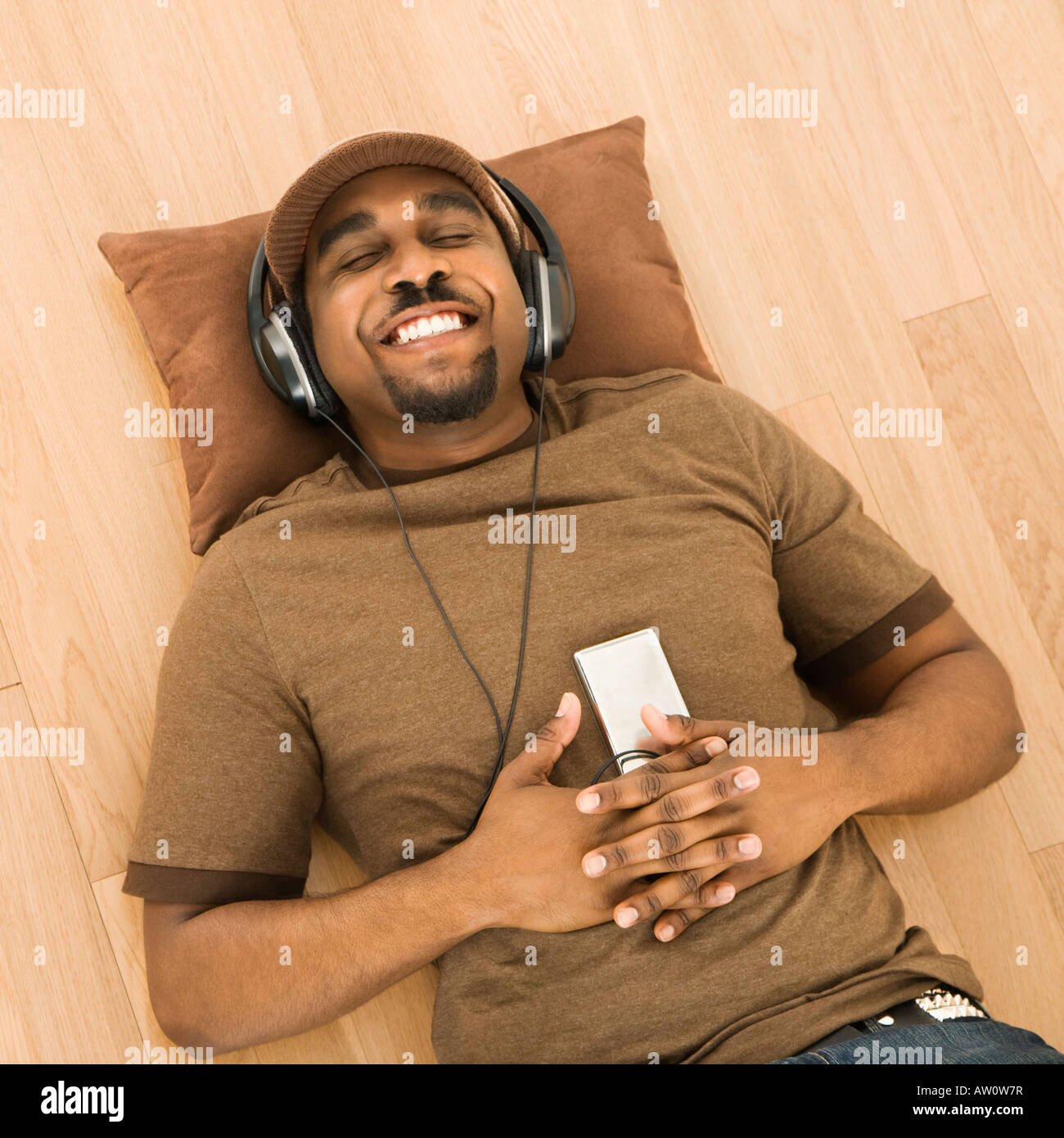 Man relaxing to music Stock Photo - Alamy