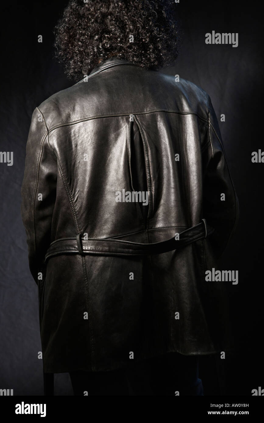 Back of woman in leather coat Stock Photo - Alamy
