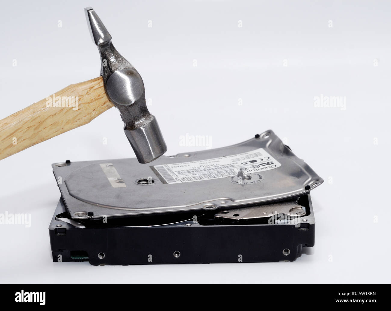 Smashing hard disc drive with hammer Stock Photo - Alamy