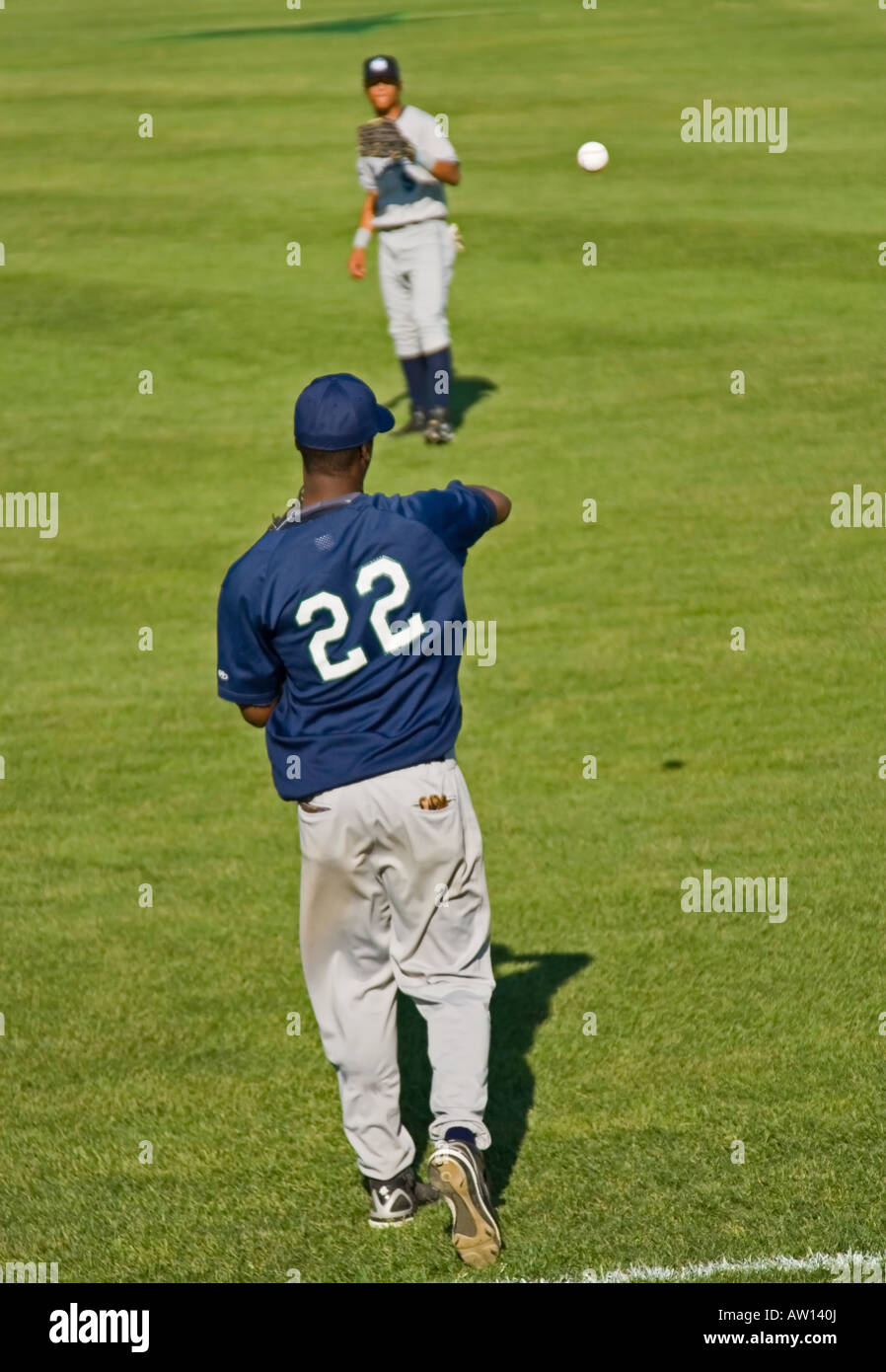 Baseball players playing the sport they love at a small stadium of the ...
