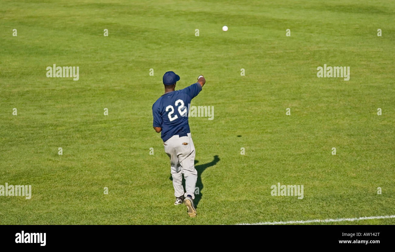 Baseball players playing the sport they love at a small stadium of the ...