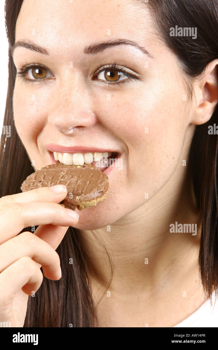 Young Woman Eating Biscuit Model Released Stock Photo - Alamy
