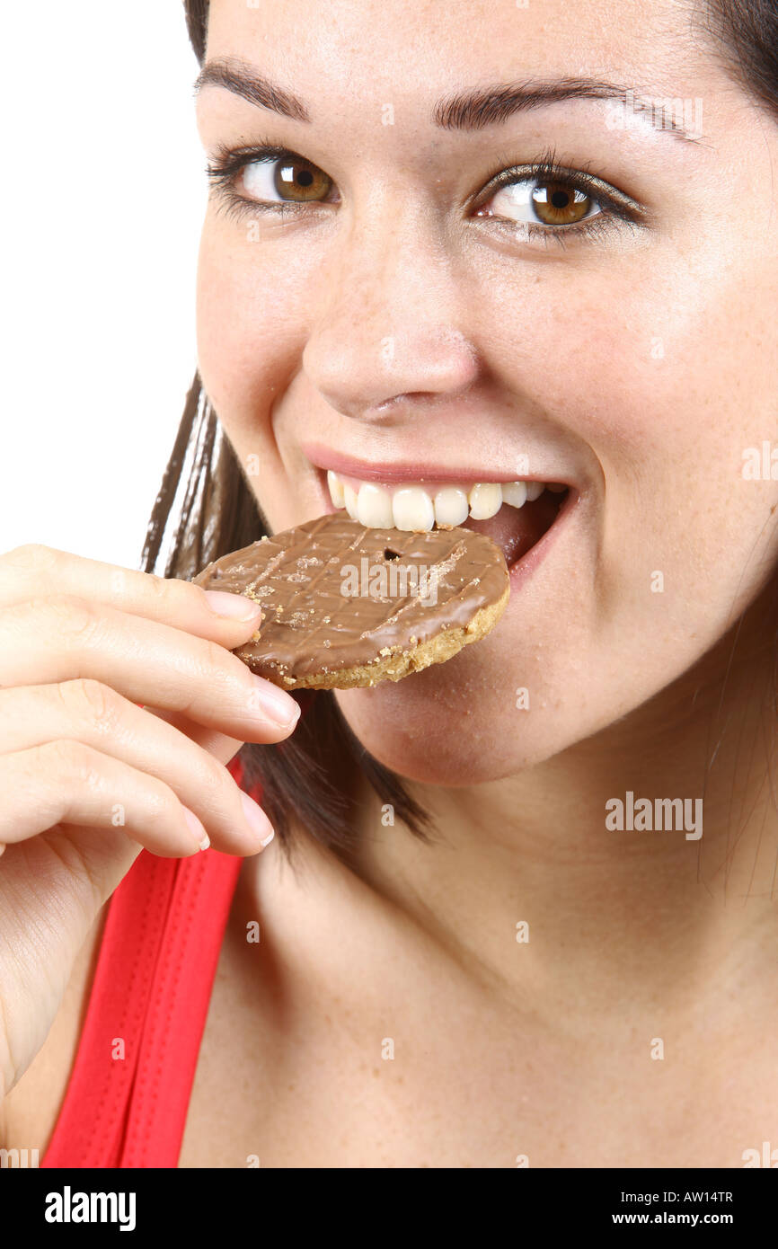 Young Woman Eating Biscuit Model Released Stock Photo - Alamy