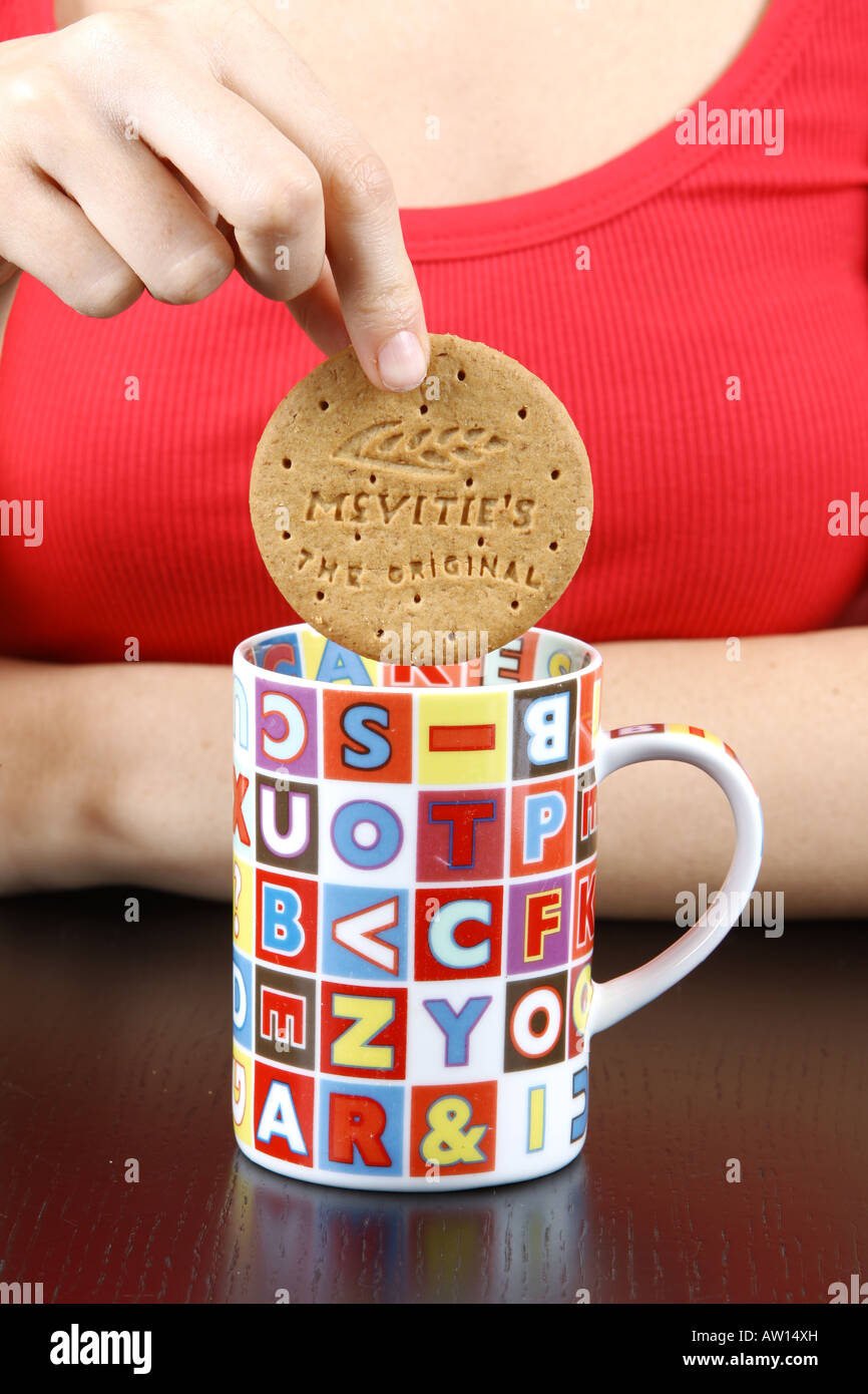 Dipping biscuit in tea hi-res stock photography and images - Alamy