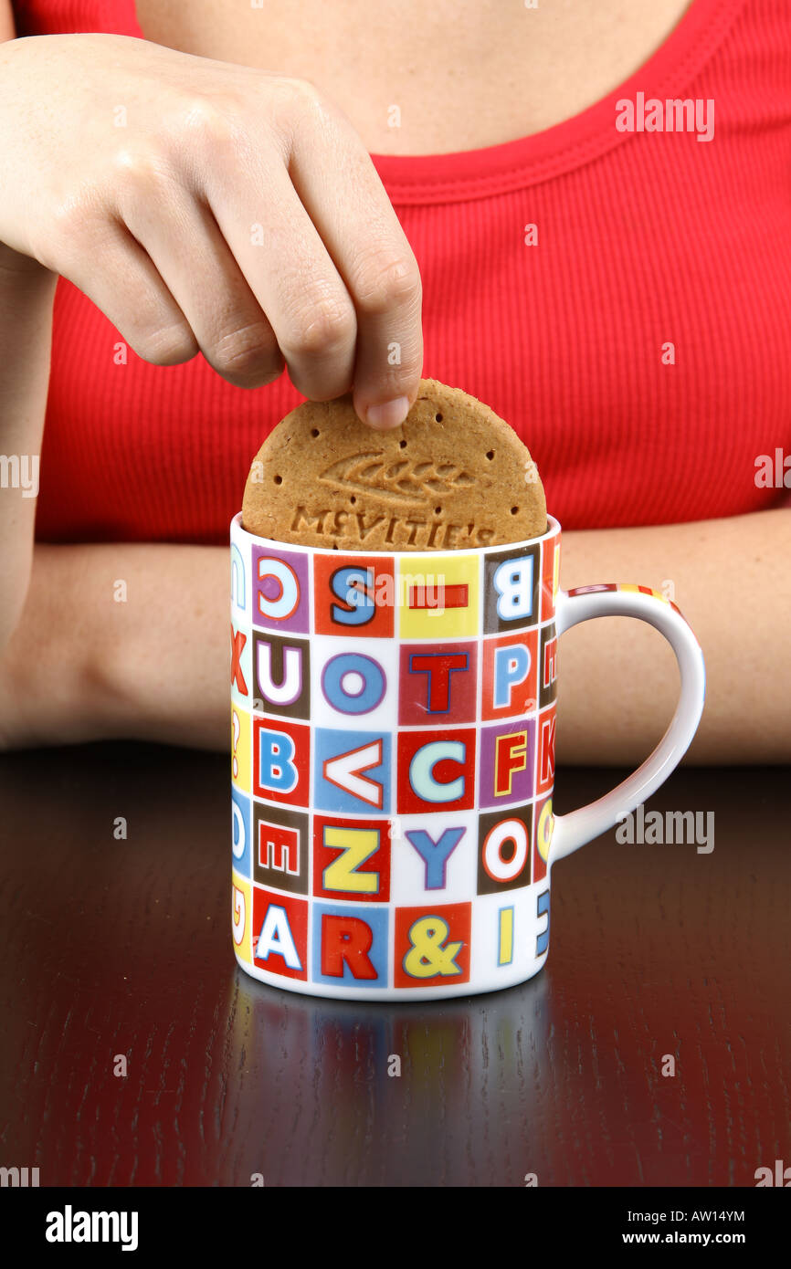 Dipping biscuit in tea hi-res stock photography and images - Alamy