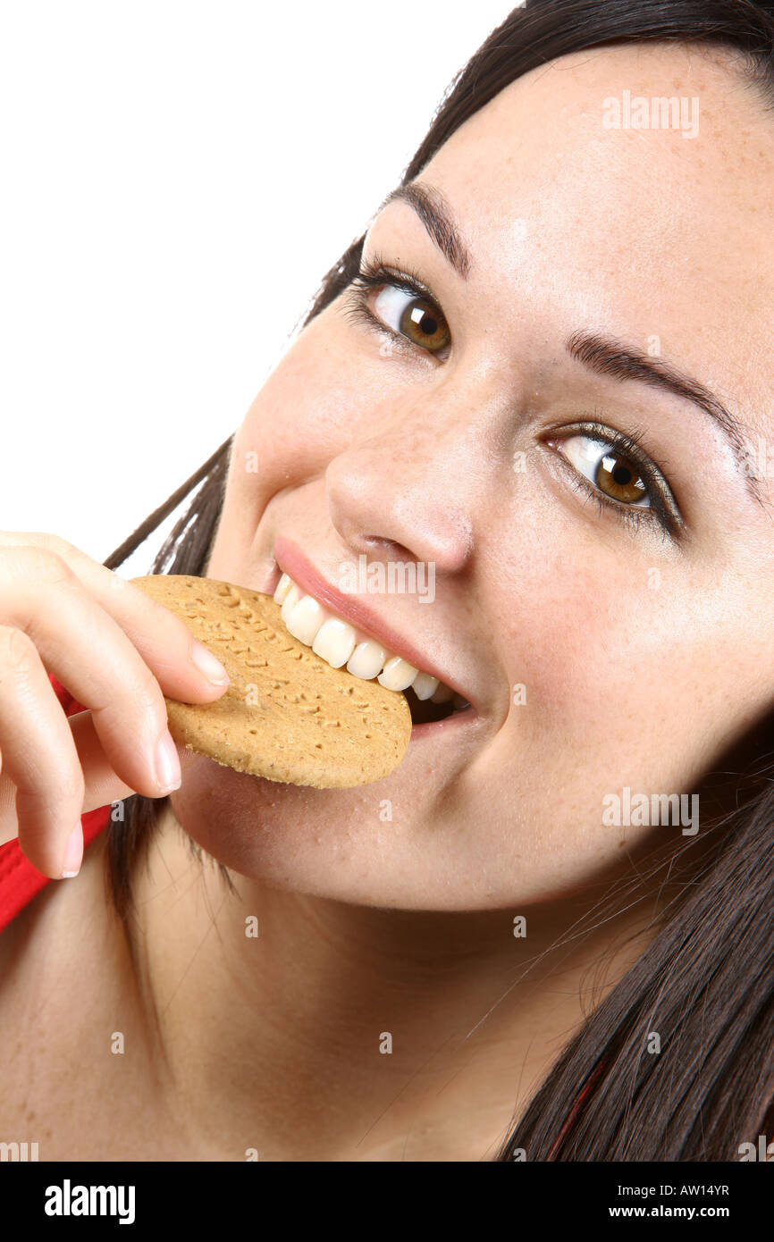 Young Woman Eating Biscuit Model Released Stock Photo - Alamy