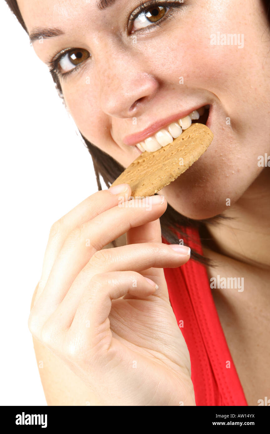 Young Woman Eating Biscuit Model Released Stock Photo - Alamy