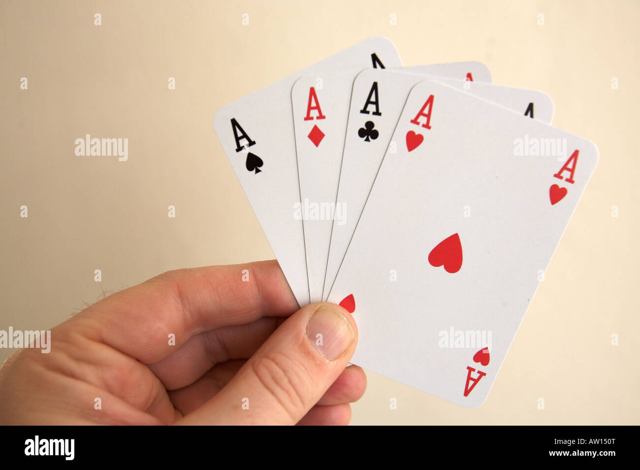A hand of four aces Stock Photo - Alamy