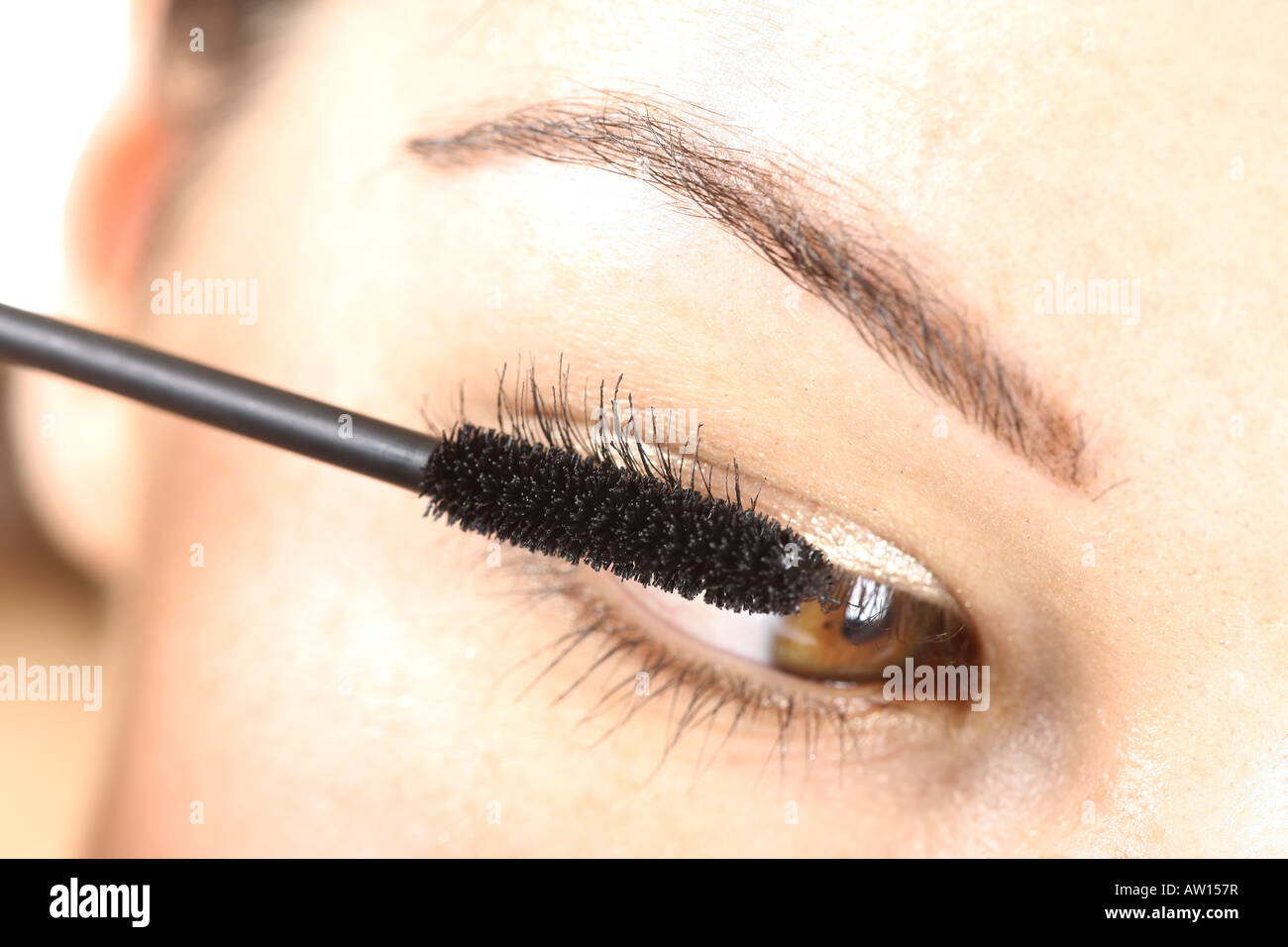 Young Woman Applying Mascara Model Released Stock Photo - Alamy