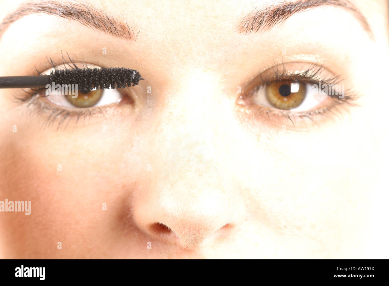 Young Woman Applying Mascara Model Released Stock Photo - Alamy