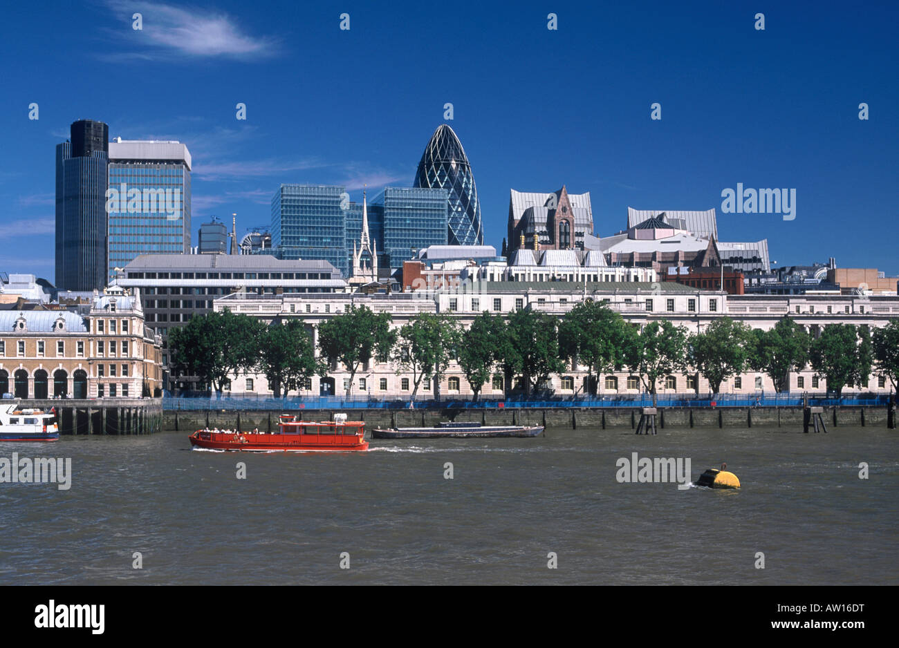 View across the River Thames of Custom House and buildings of the City ...