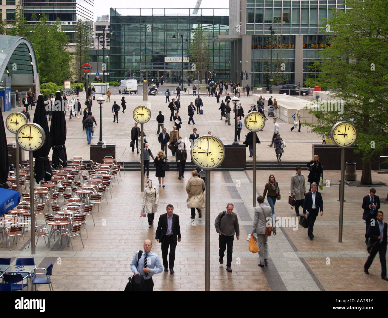 commuter workers traveling walking to work clocks Stock Photo - Alamy