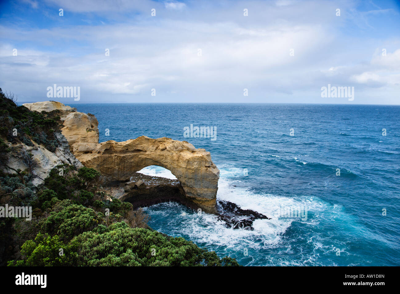 Rock arch in ocean Stock Photo - Alamy