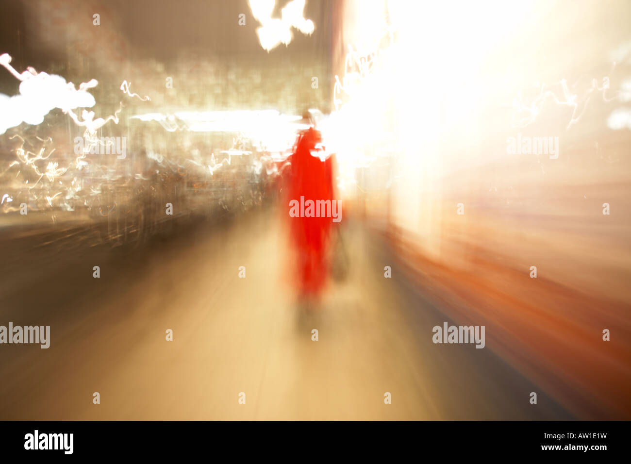 Lady in red walking through a London city street England UK Stock Photo ...
