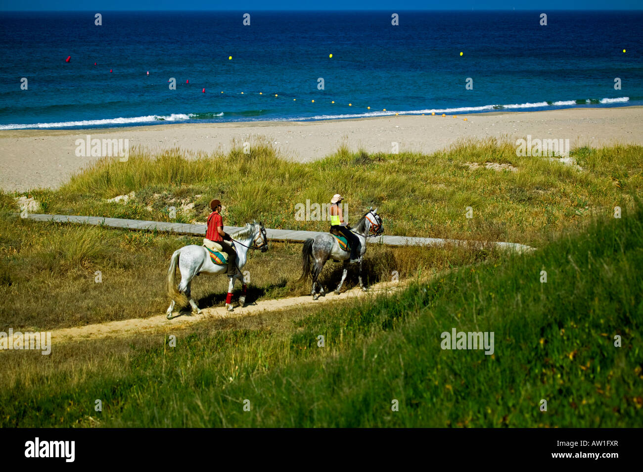 Two Horse riders pony trekking, Tarifa Beach, Southern Spain, Europe ...