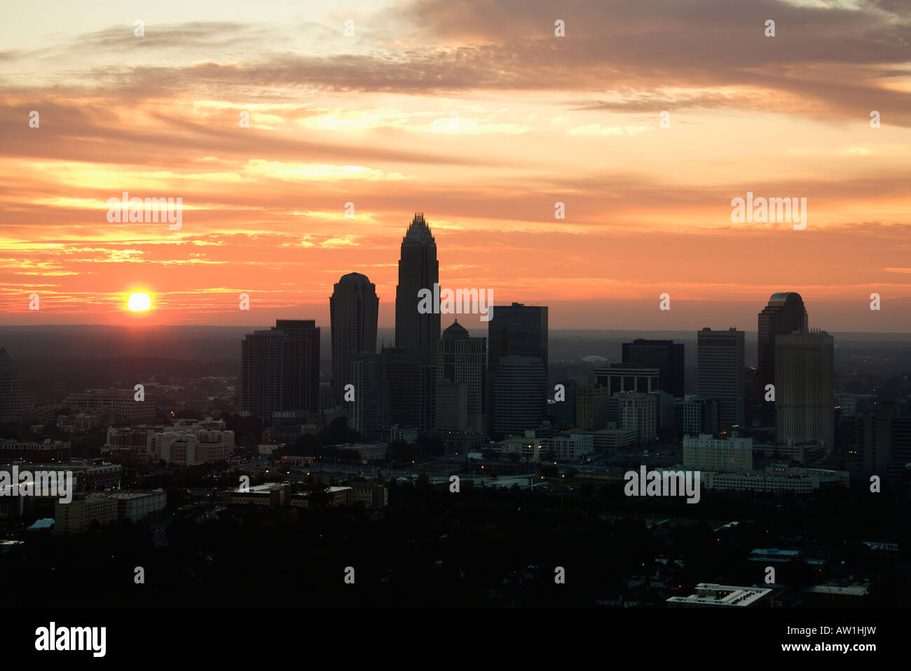 Aerial view of sunset behind city skyline of Charlotte North Carolina ...