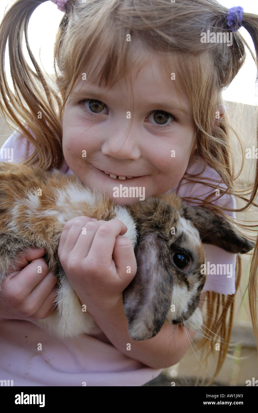 Child cuddle rabbit hi-res stock photography and images - Alamy