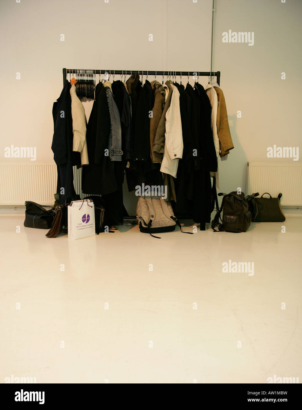 Coat rail full of coats Stock Photo - Alamy