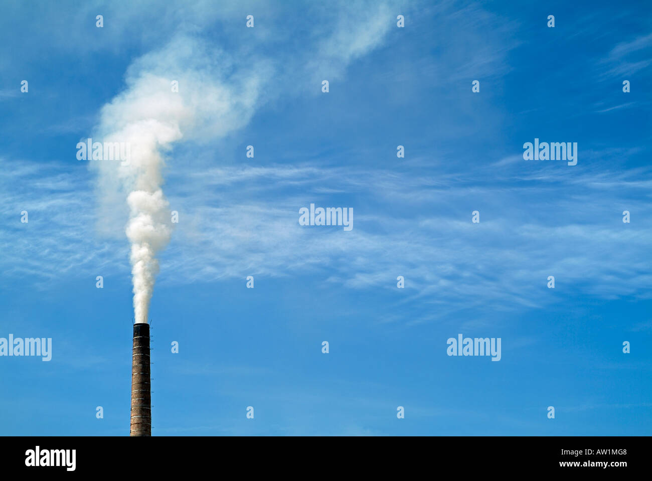 Smoking Factory Chimney pumping out pollution into the atmosphere ...