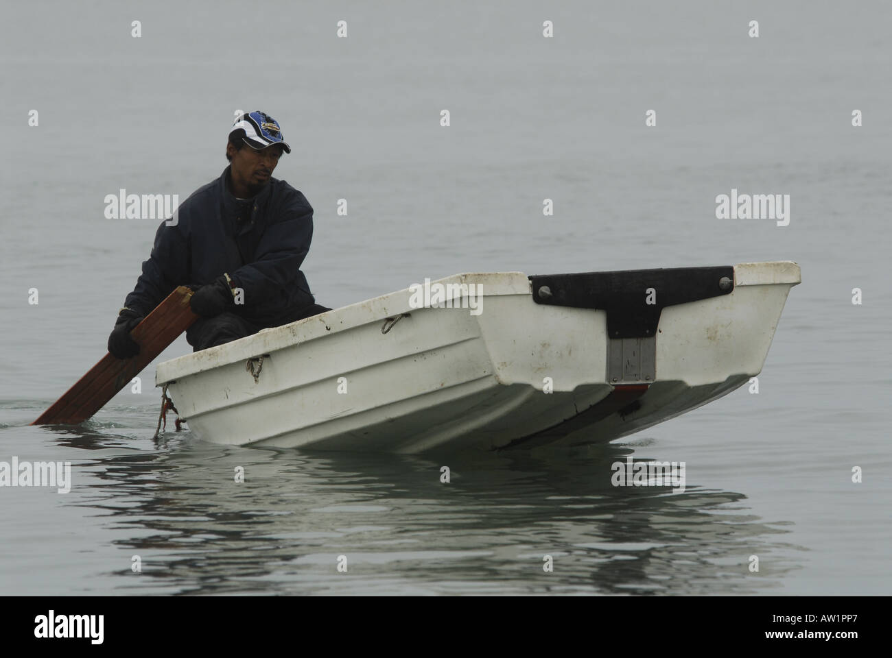 Inuits rowing on a wooden boat Pond Inlet Baffin Island High Arctic ...