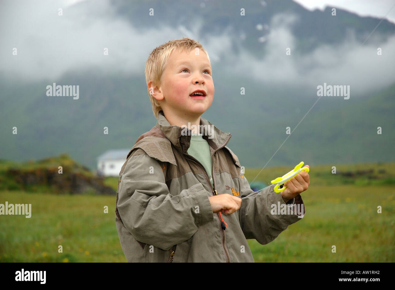 Little boy flying his kite, Lofoten Islands, Norway Stock Photo - Alamy