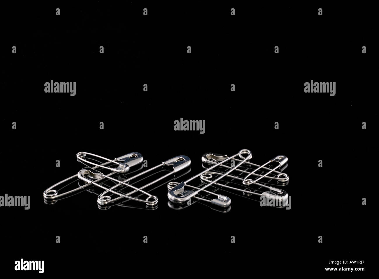 Chrome safety pin Stock Photo - Alamy