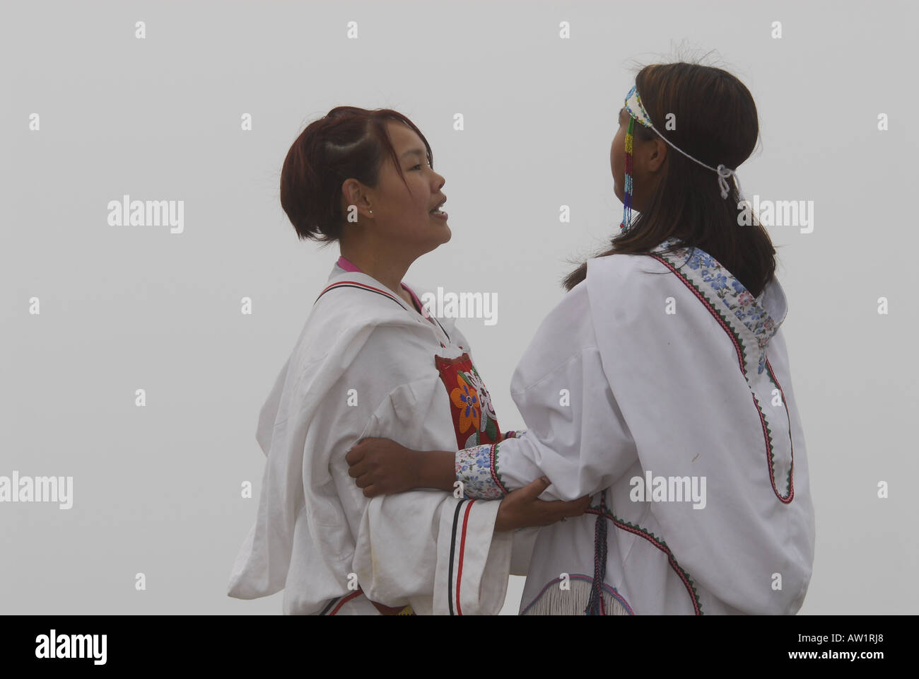 Model released inuit teens throat singing wearing their traditional ...