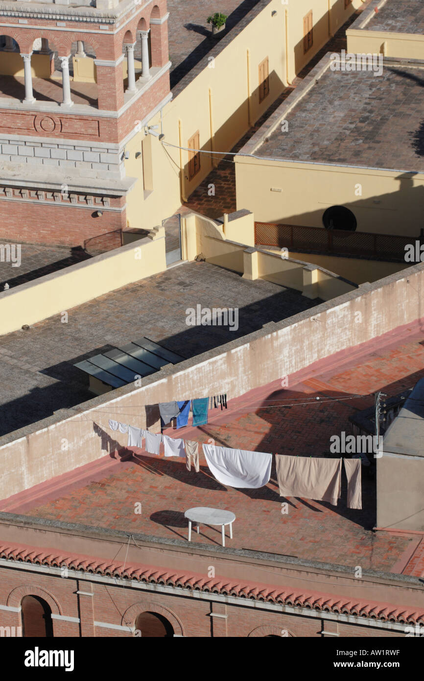 Washing line with clothes hanging to dry on rooftop in city centre ...