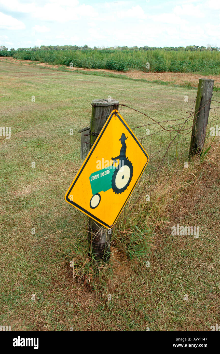 Tractor and a driver on the real farm sign in rural america in the ...