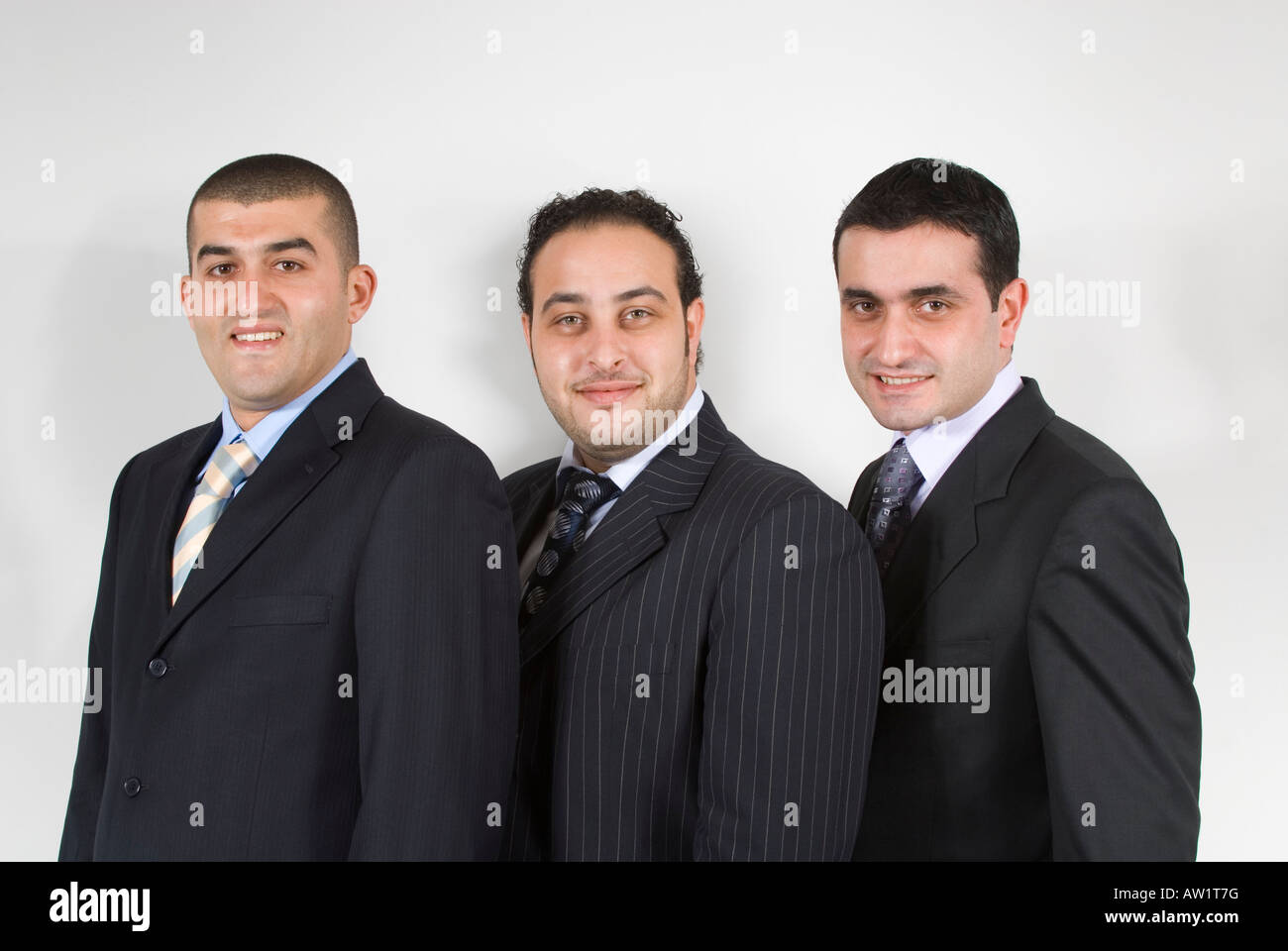 3 three business men smiling Stock Photo - Alamy