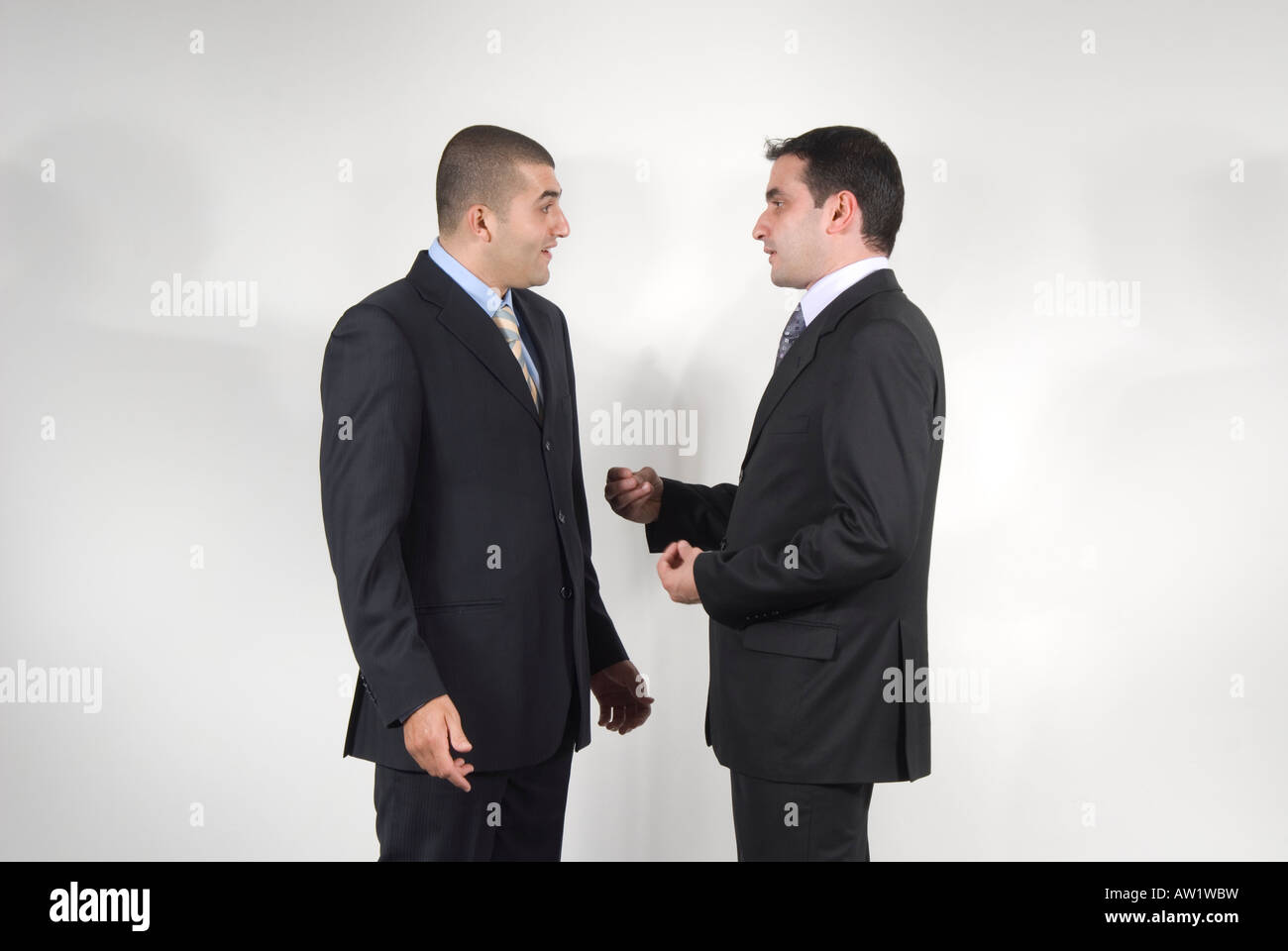 Two businessmen talking Stock Photo - Alamy