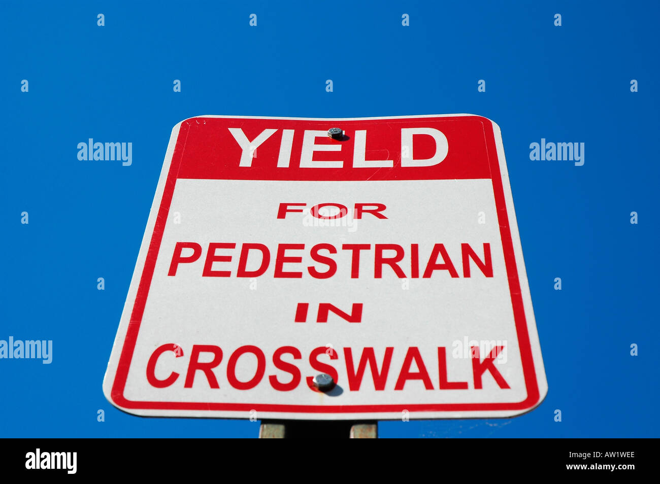 Crosswalk signs on pole hi-res stock photography and images - Alamy