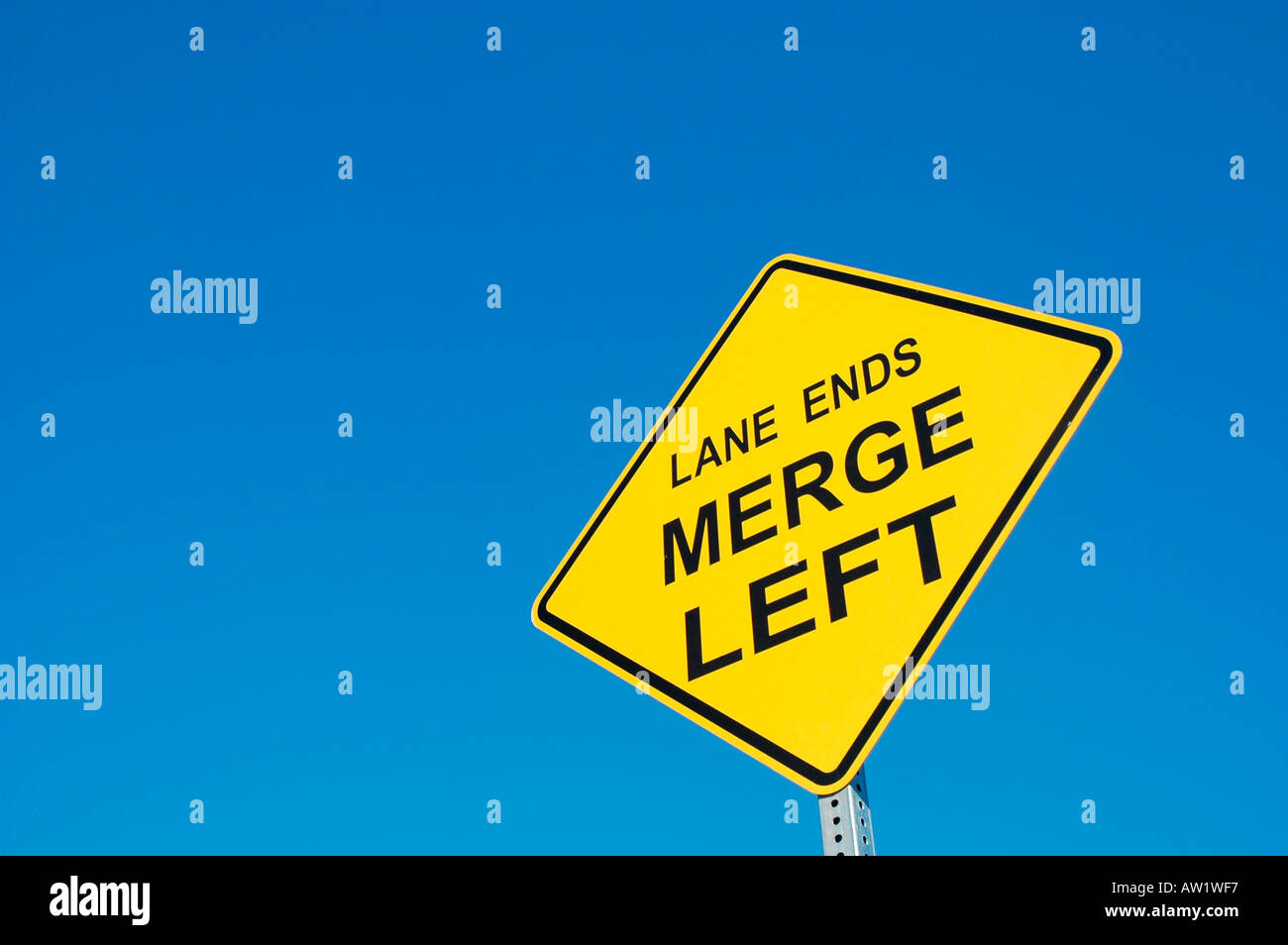 Lane ends Merge Left Traffic Signs Stock Photo - Alamy