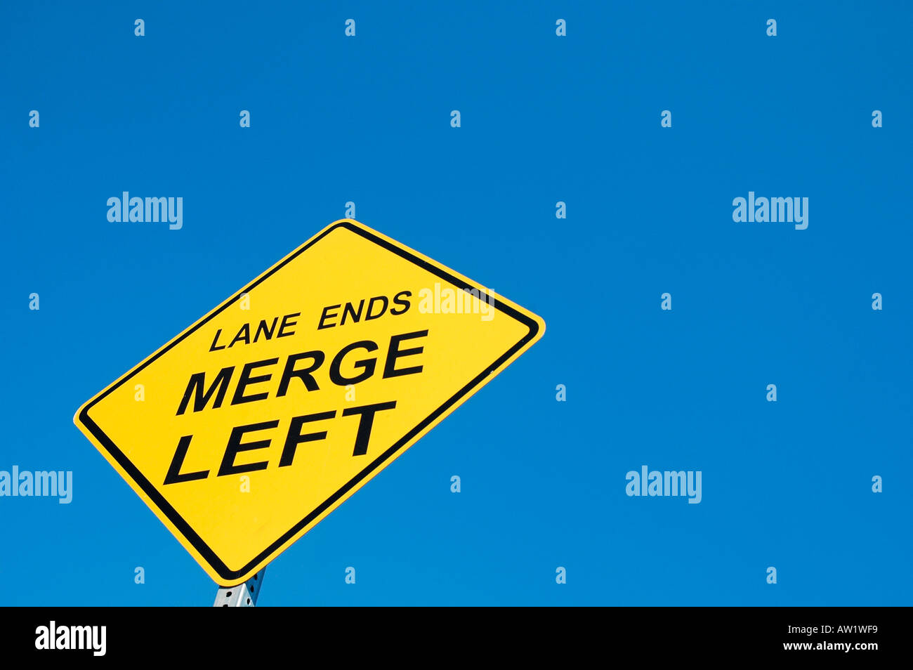 Lane ends Merge Left Traffic Signs Stock Photo - Alamy