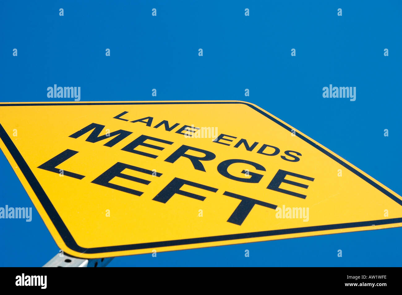 Lane ends Merge Left Traffic Signs Stock Photo - Alamy