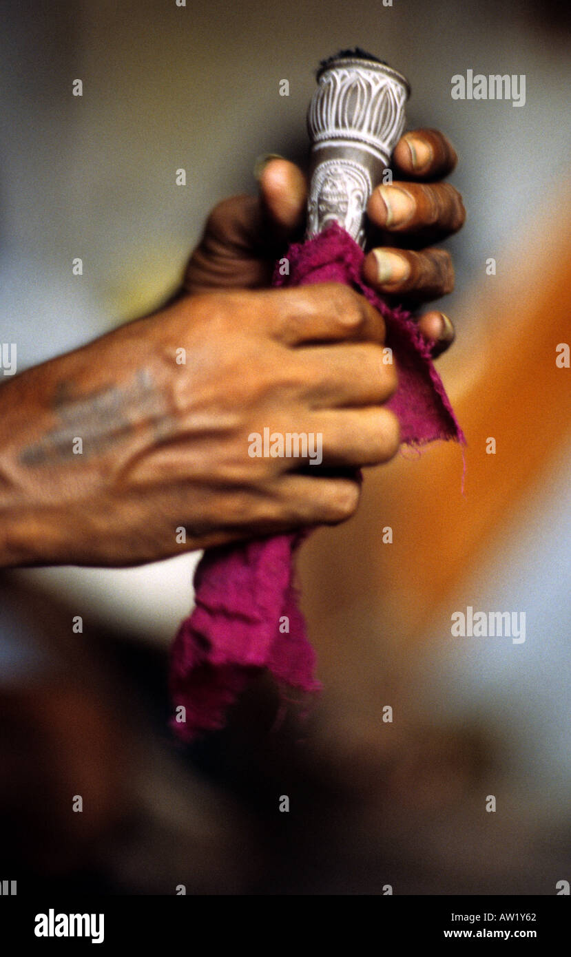 Baba, an Indian holy man, smoking grass with the traditional cilum pipe ...